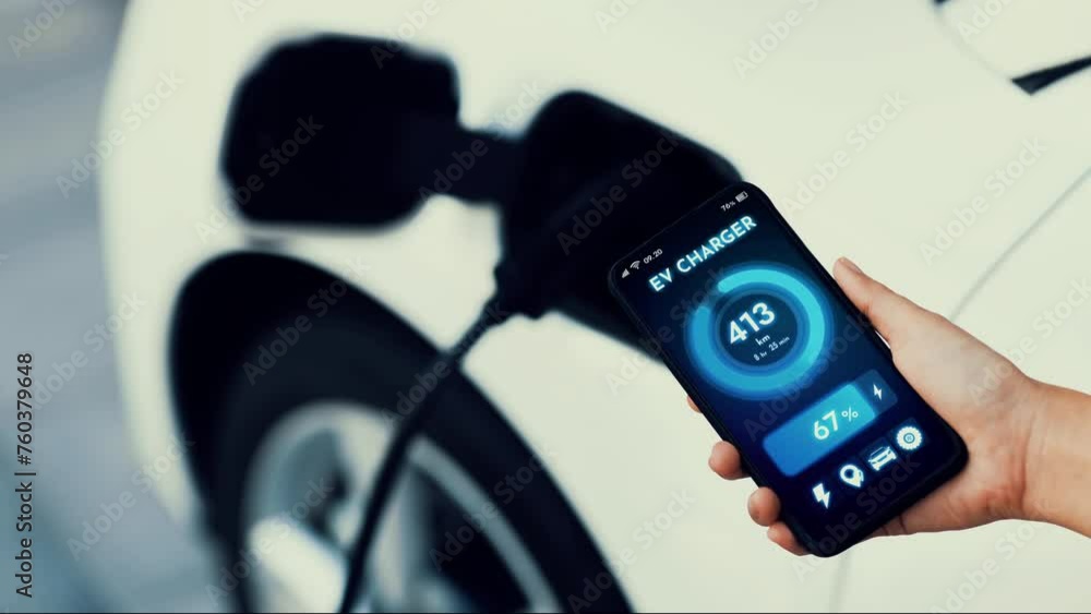 Smartphone display battery status on smart EV mobile application while ...