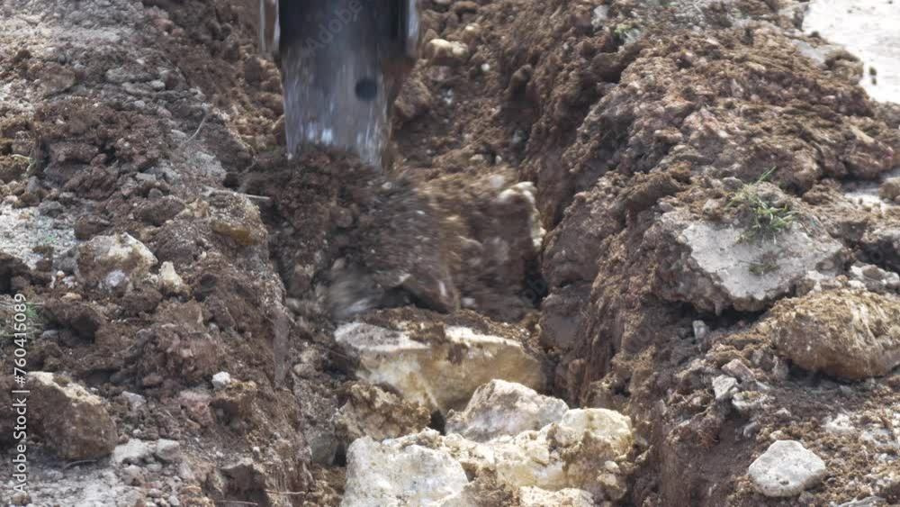 Excavator, trench, stone - Excavator digs stone to create trench on ...