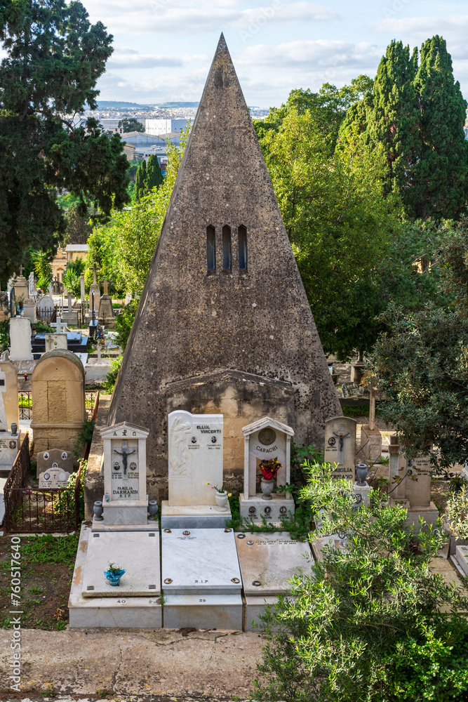 Paola, Malta - December 6th 2018: Headstones in front of a pyramid ...