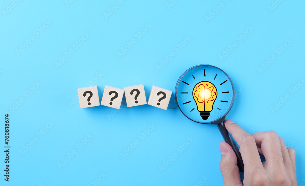 Idea discovery and inquiry concept. Hand holding a magnifying glass ...