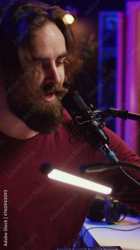 Vertical Video Artist singing a song at microphone and playing ...