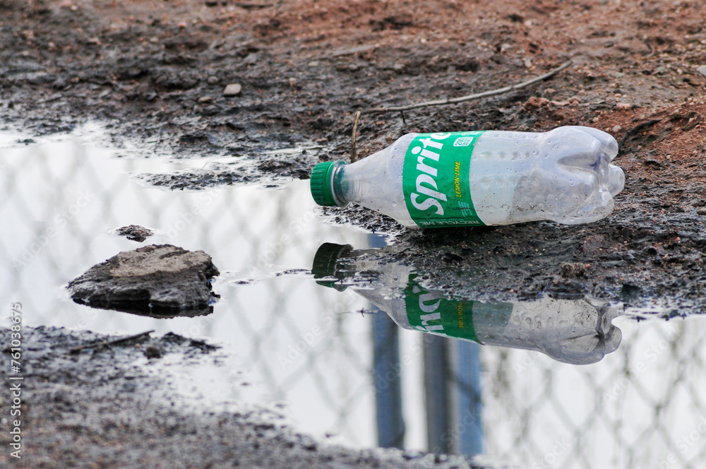 An empty plastic Sprite soft drink container, unrecycled and discarded ...