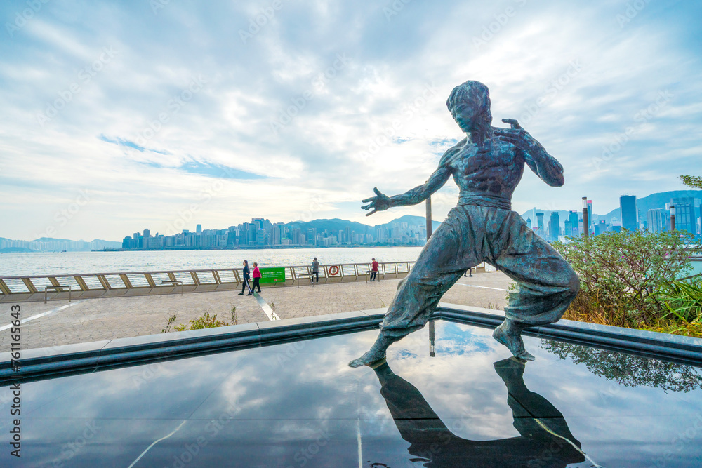 Bruce Lee statue in Avenue of Stars. In the distance is Victoria ...