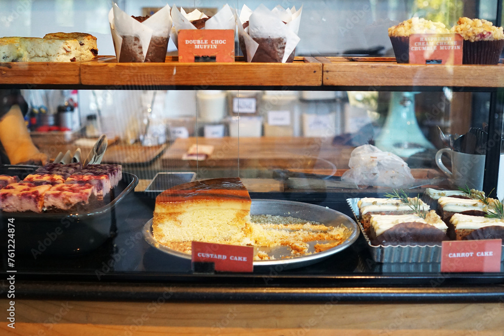 Wooden bakery and pastry display counter shelf contains custard and ...