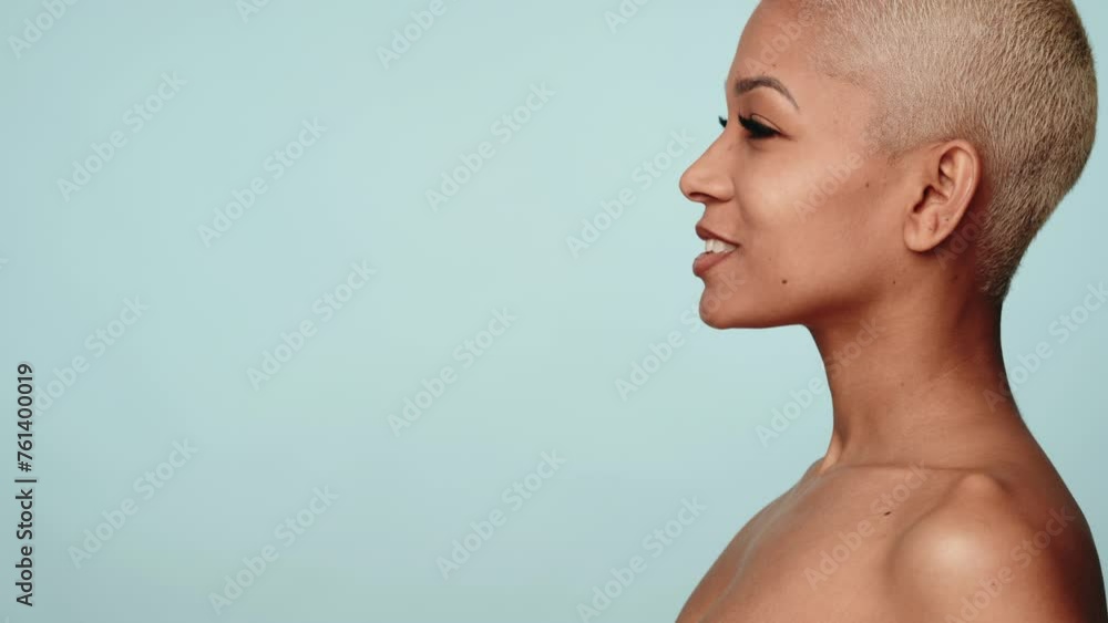 Profile of a cheerful Hispanic woman with buzz cut hairstyle, smiling ...