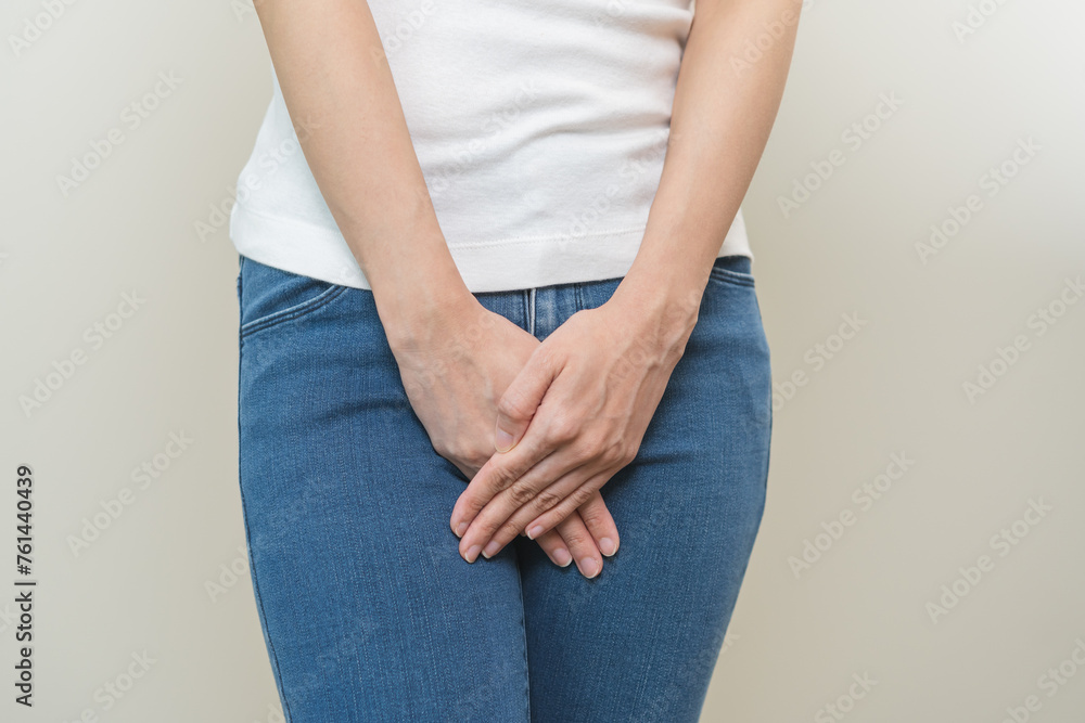 Vaginal, urinary incontinence. Pain asian young woman hand holding ...