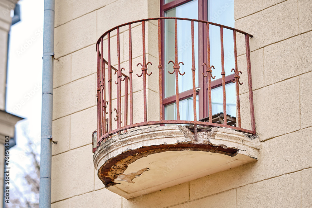 Damaged balcony of an old historic building. Damaged balcony floor ...