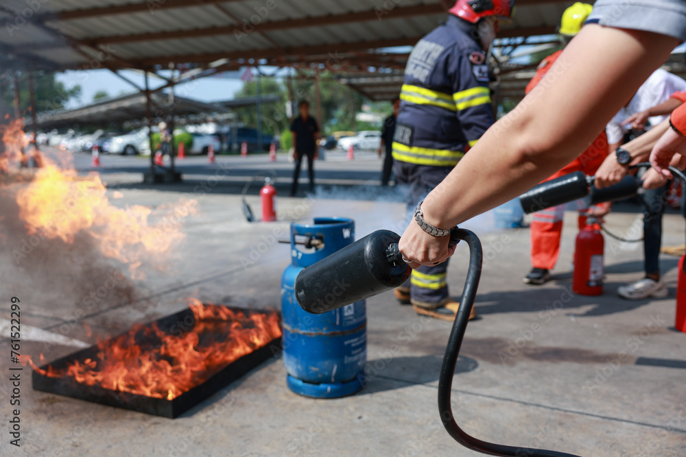 Employees firefighting training, Concept Employees hand using fire ...