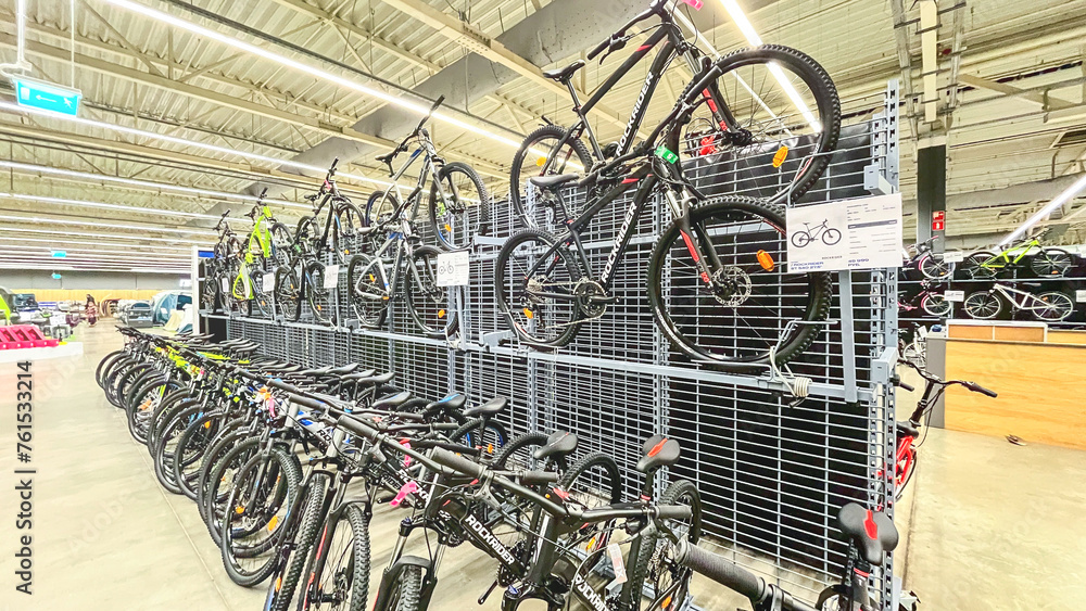 Moscow February 26 2024. Multiple colorful cycles kept on display in a ...