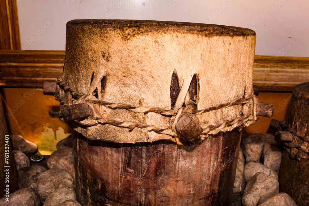Rustic drum, made of hollow trunk and animal skin, used in the ...