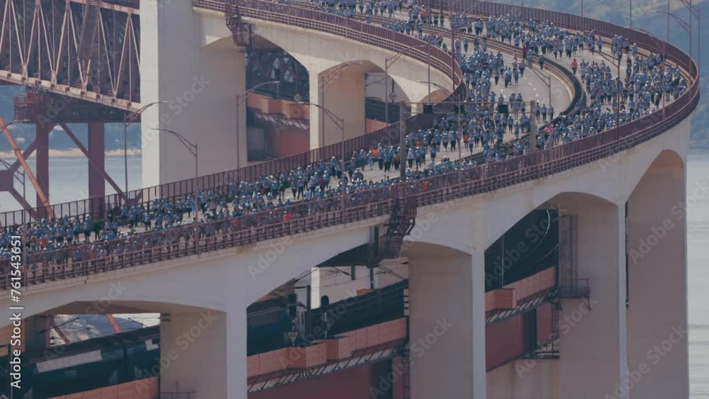 Running Lisbon half marathon crossing the 25 of April bridge over the ...