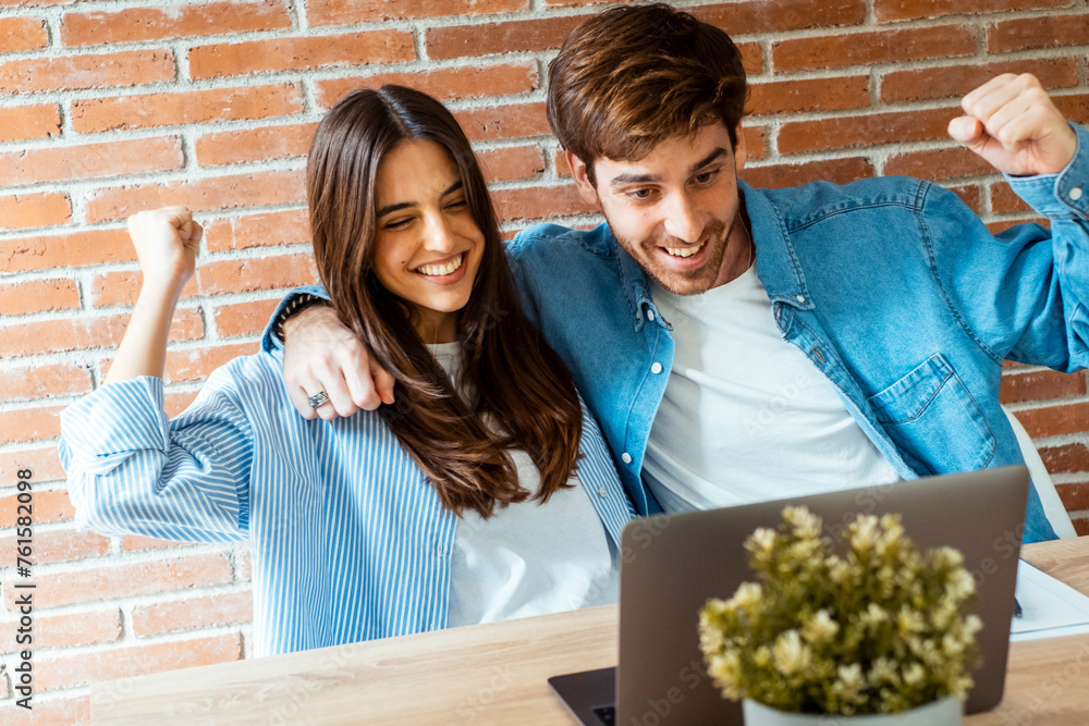 Win online and successful emotion. Two people man and woman with ...