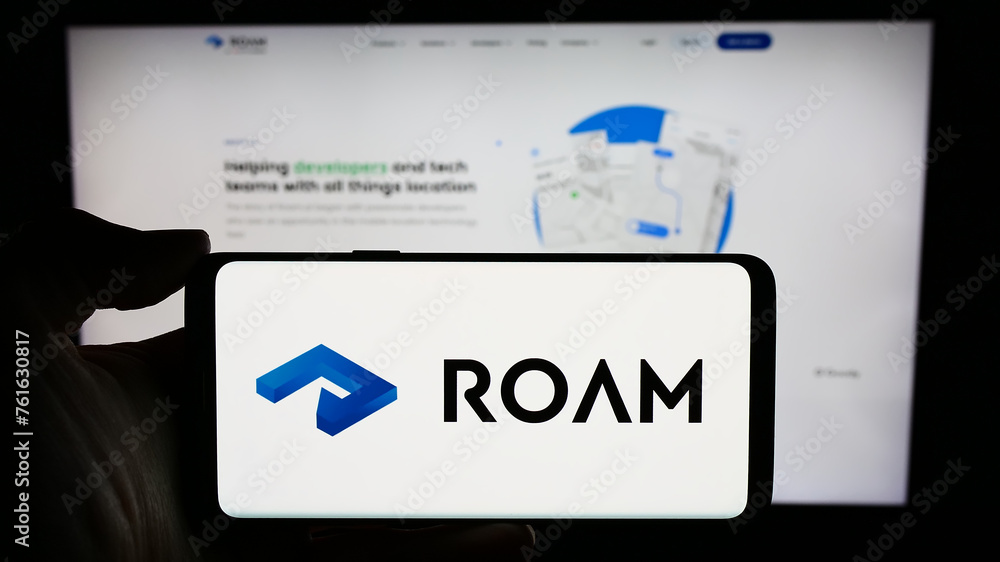 Stuttgart, Germany - 03-10-2024: Person holding cellphone with logo of Dutch location tracking ...