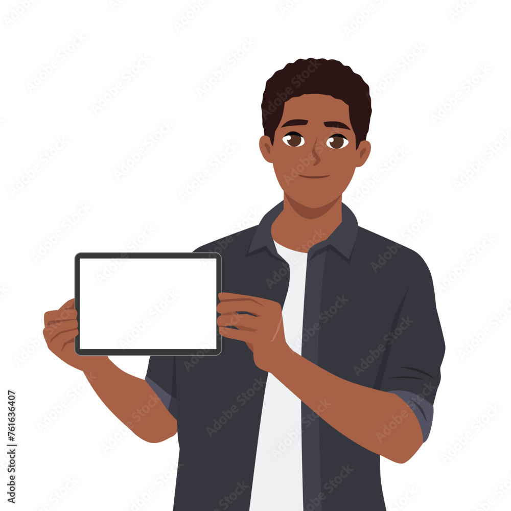 Young black man holding digital tablet, showing screen with blank copy ...