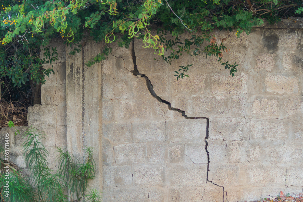 Crack in a concrete fence made of cement blocks, appeared as a result ...