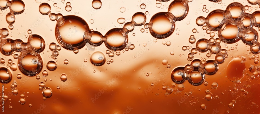 Brown bubbles with amber hues float in the water, creating a ...