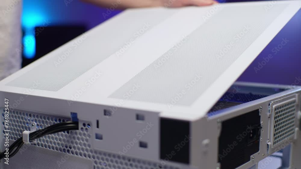 Cropped shot of computer master installing side cover on PC system unit ...