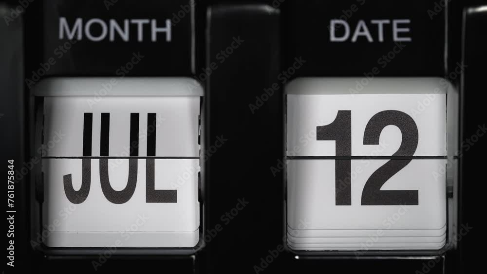 retro flip calendar with a date change from the eleventh of July to the ...
