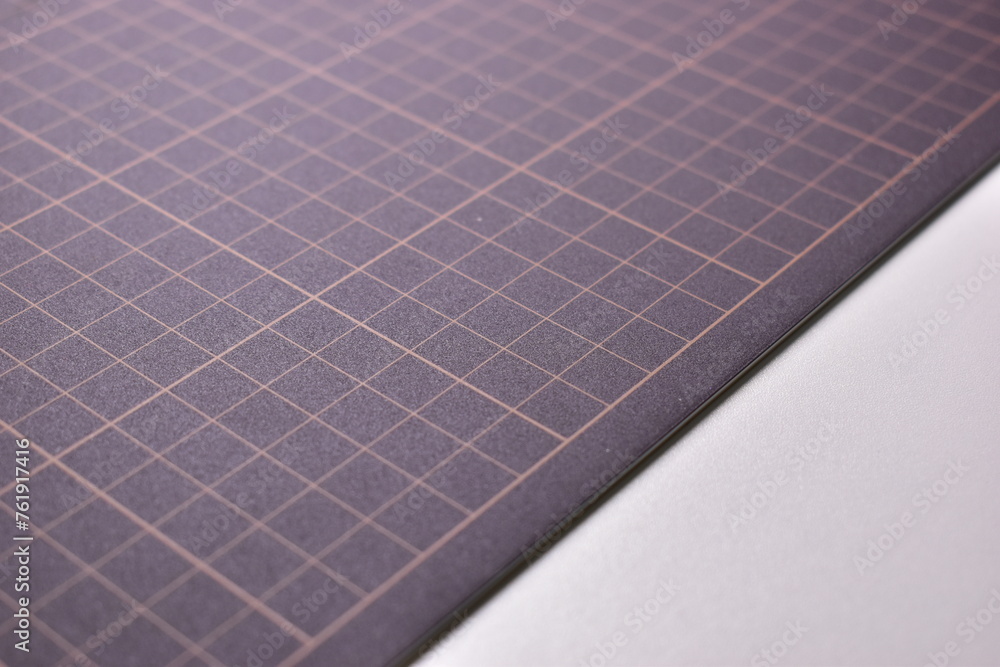 black cutting mat board on white background with line and scale measure ...