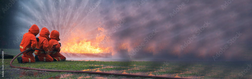 Firefighter Rescue training in fire fighting extinguisher. Firefighter ...