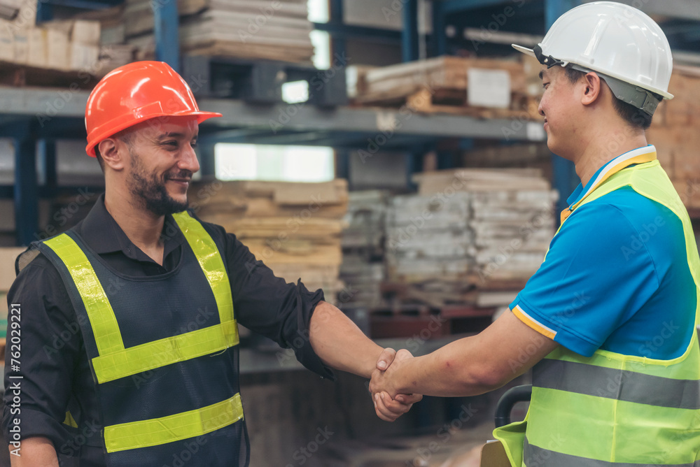 Teamwork Warehouse worker shakehand together. Engineer man hands ...
