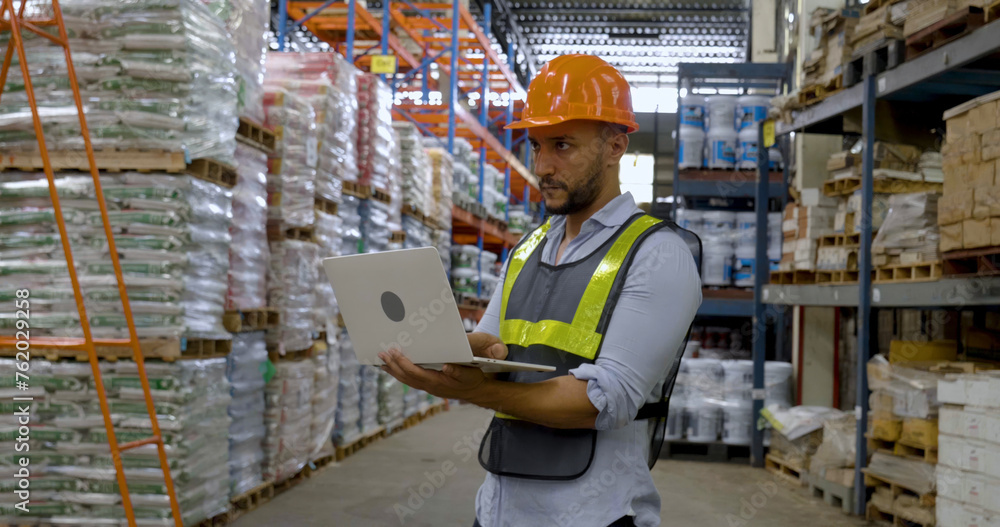 Hispanic men hands using typing laptop computer Warehouse management ...