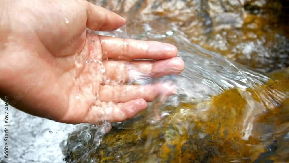 focus on palms. The gentle stream of water creates a soothing and ...