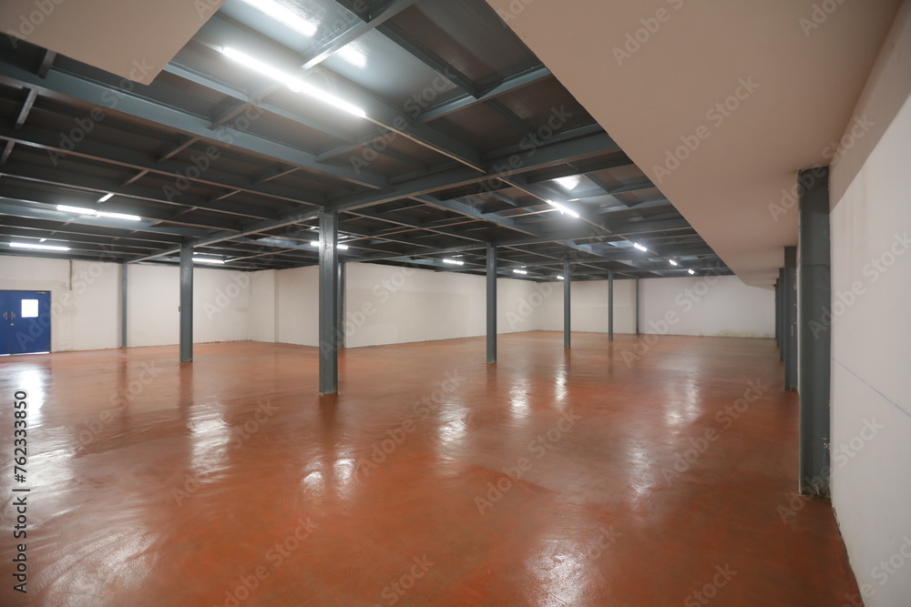 empty warehouse filled with pharma blue container rack for storage and ...