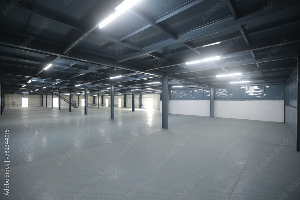 empty warehouse filled with pharma blue container rack for storage and ...