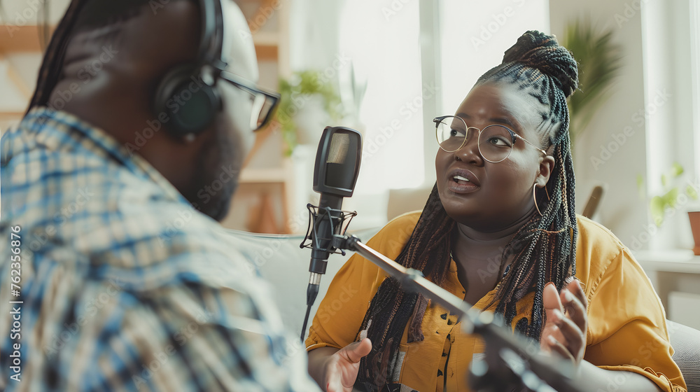 African people having fun talking on microphone inside studio while ...