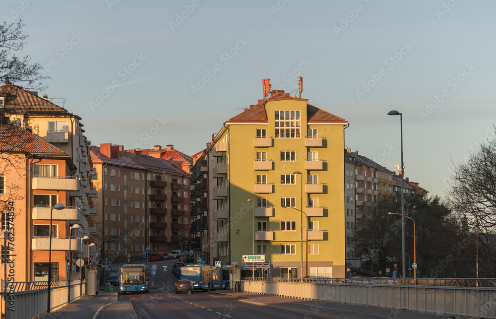 Apartment houses on the island Lilla Essingen, bridge and bus stops, an ...