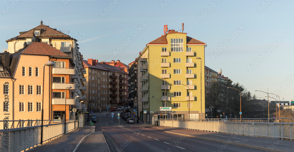 Apartment houses on the island Lilla Essingen, bridge and bus stops, an ...