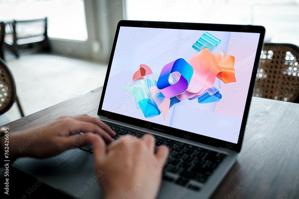 Bangkok. Thailand. MAR 20,2024 :A man useing laptop computer displaying ...