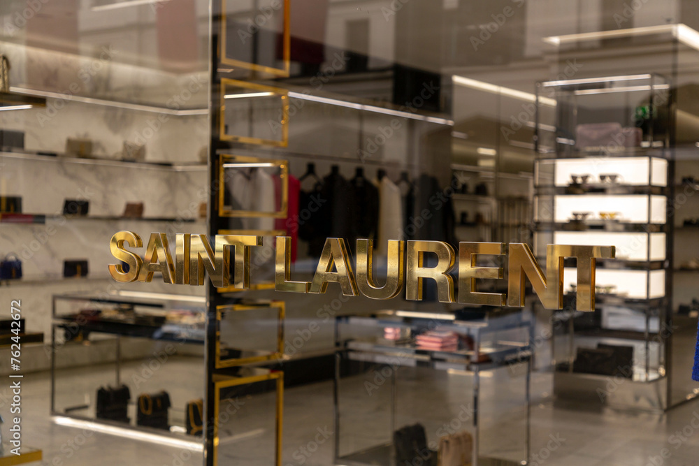 Yves Saint Laurent sign and logo at the entrance of luxury stores on ...