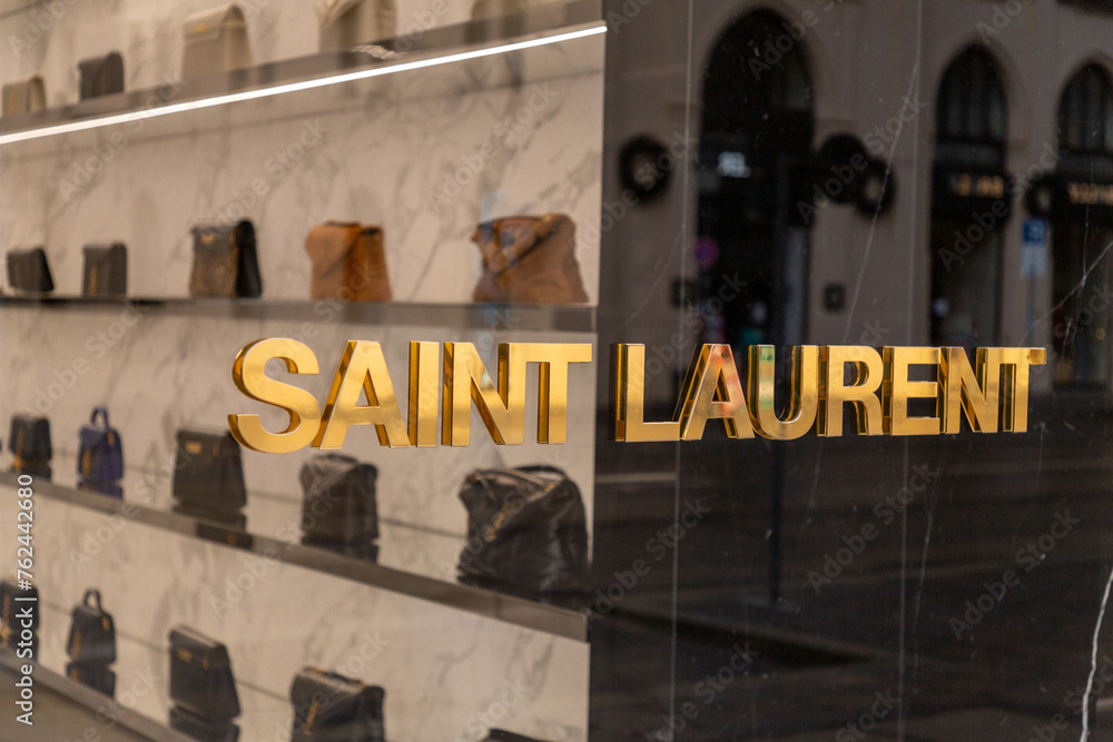 Yves Saint Laurent sign and logo at the entrance of luxury stores on ...