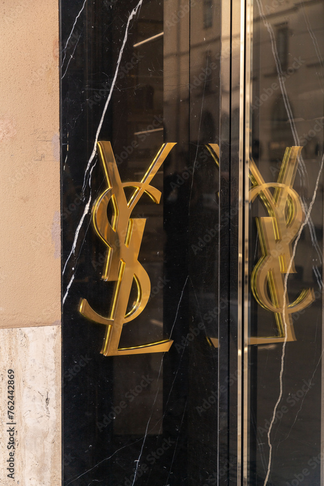 Yves Saint Laurent sign and logo at the entrance of luxury stores on ...