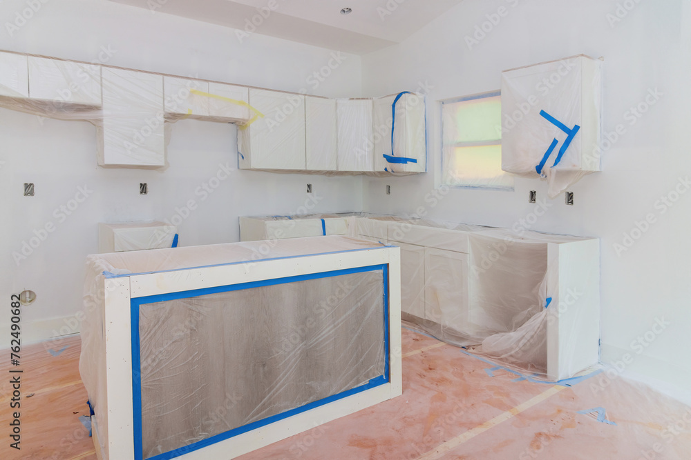 Poster Cabinets are being installed in newly constructed house with ...