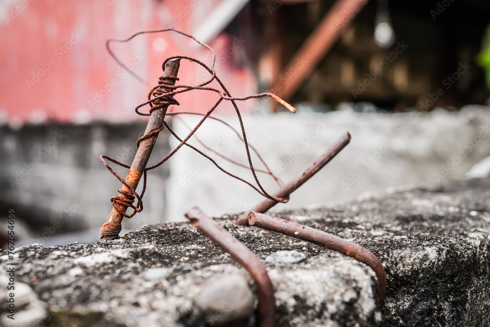 The iron framework of the concrete building's columns sticking out on ...