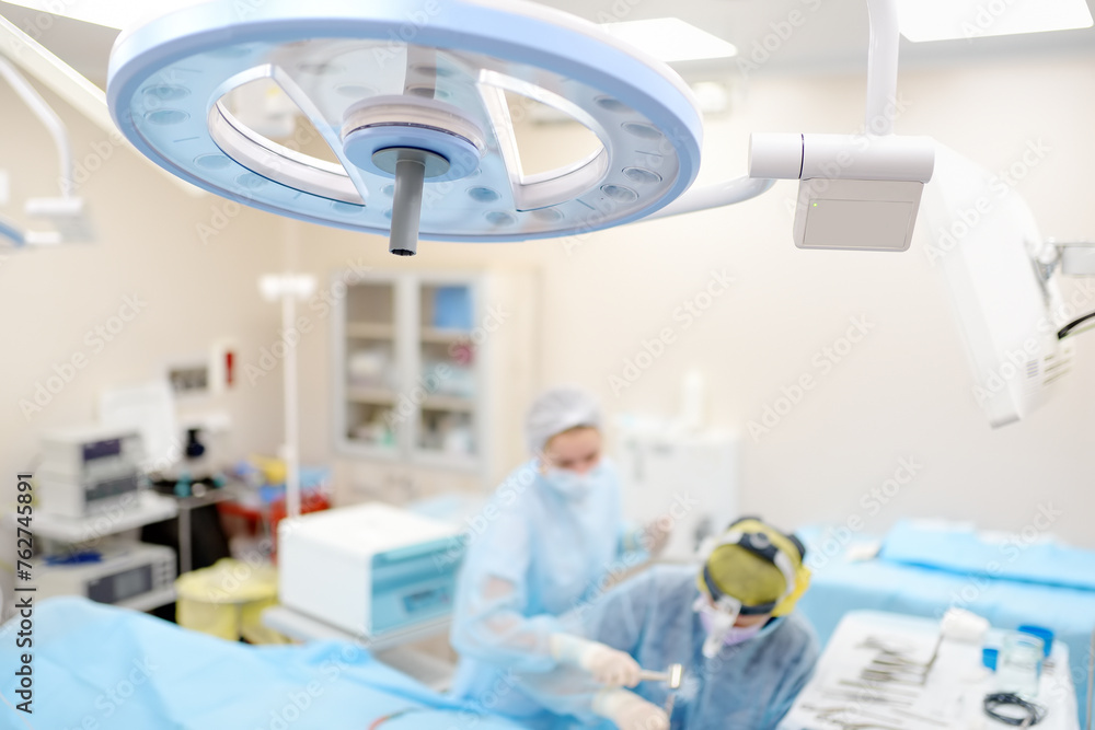 Surgeons are during maxillofacial operation using microscope and ...