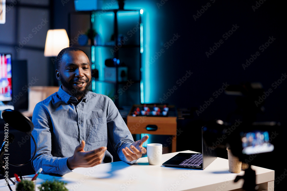 African american content creator filming technology review of different ...