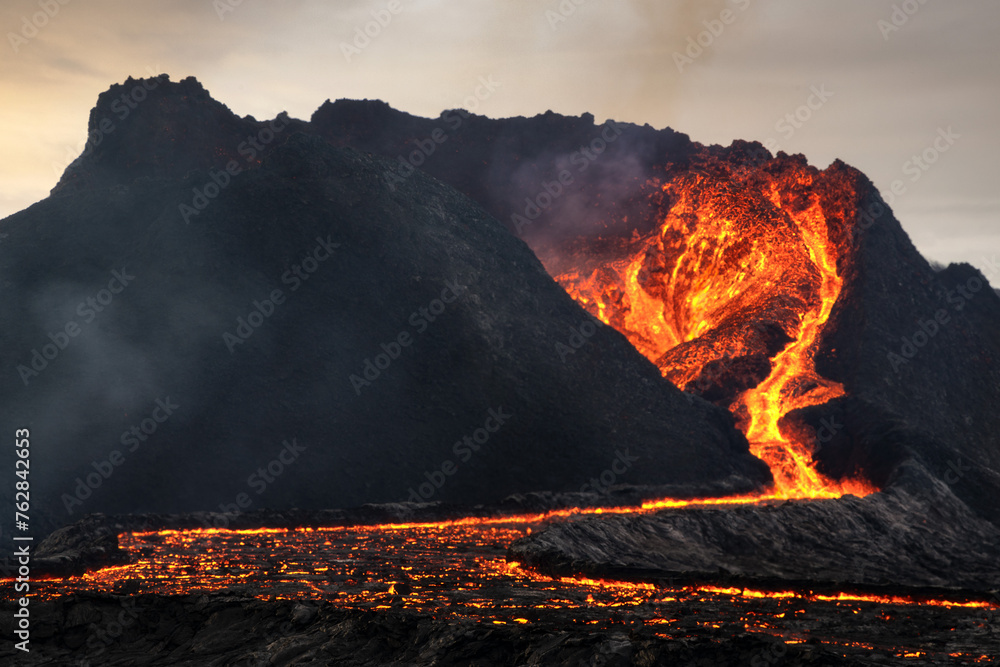 Volcanic eruption explosion and lava flow in the lava field of ...