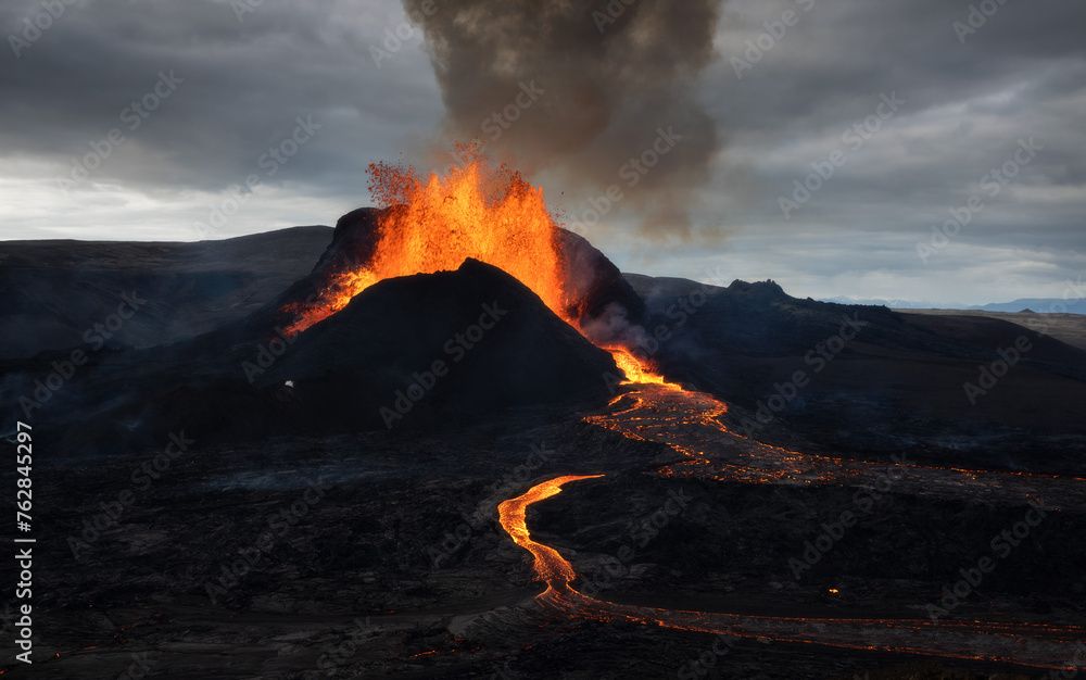 Volcanic eruption explosion and lava flow in the lava field of ...