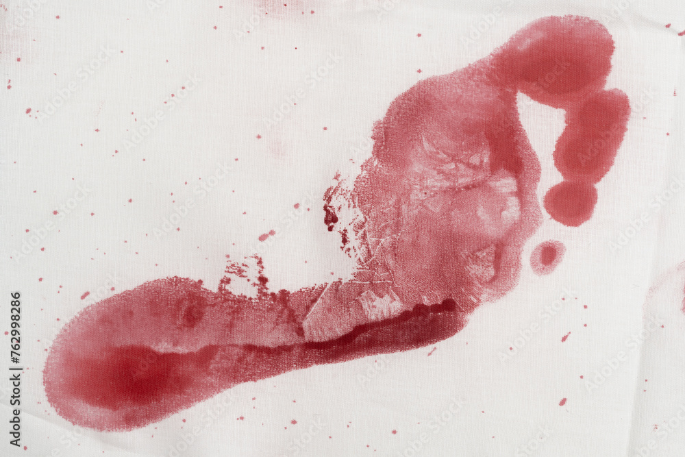 bloody footprint on a white background. bloody mark on clothes. wound ...