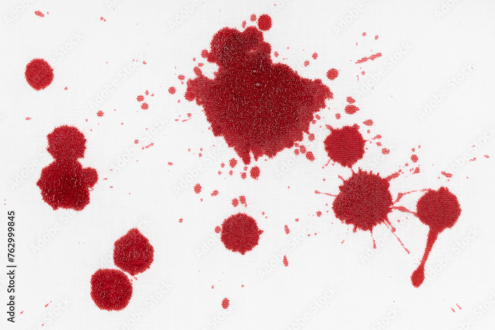 Drops of blood stains on white fabric. blood splatters on clothes. red ...