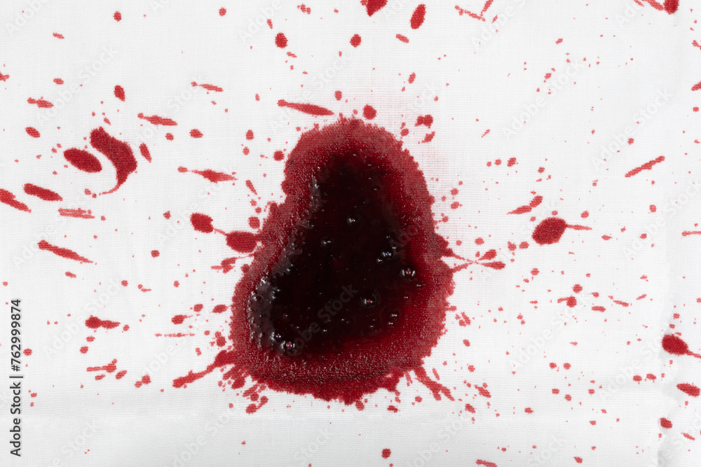 Drops of blood stains on white fabric. blood splatters on clothes. red ...