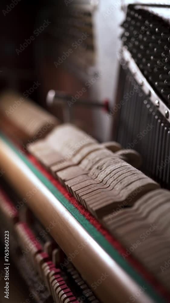 Internal parts of a piano, selective focus. Details of musical ...