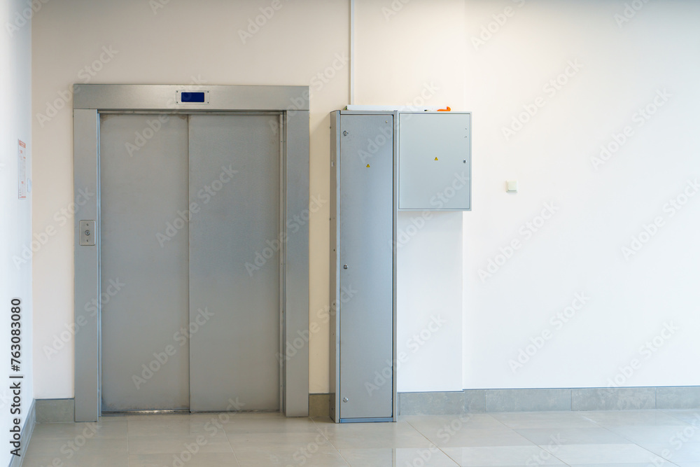 Closed elevator doors. Shiny metal elevator doors in a new modern ...