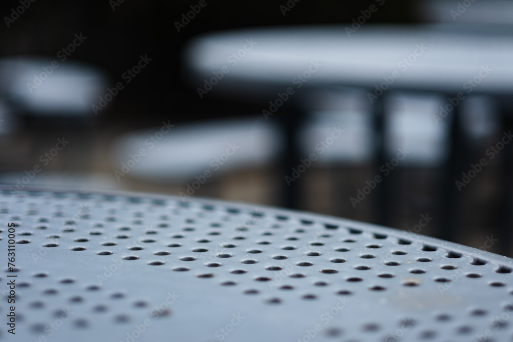 Closeup of an outdoor picnic table at a university campus. The tabletop ...