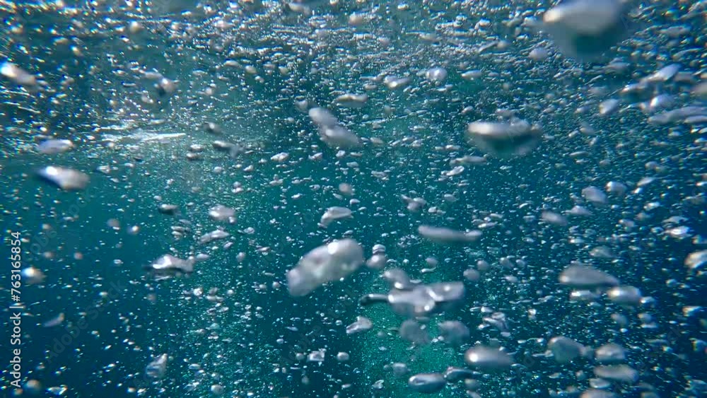 Air bubbles flow rises into the bubbling surface of the water. Endless ...