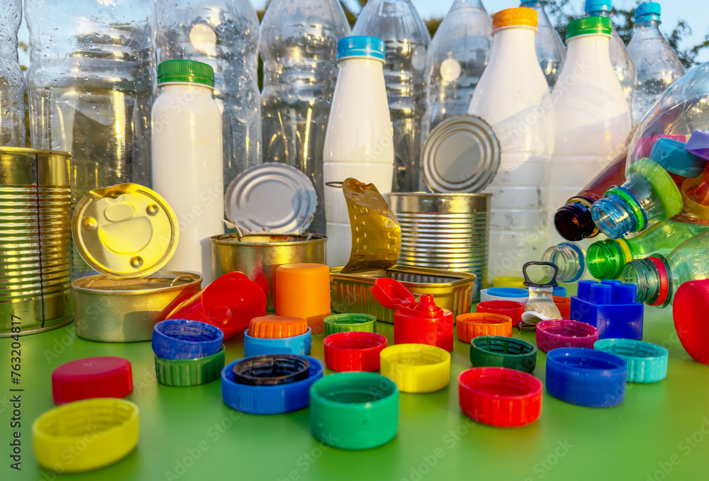 Plastic Recycling. Tin can and plastic Bottle Caps for Recycling. Steel ...